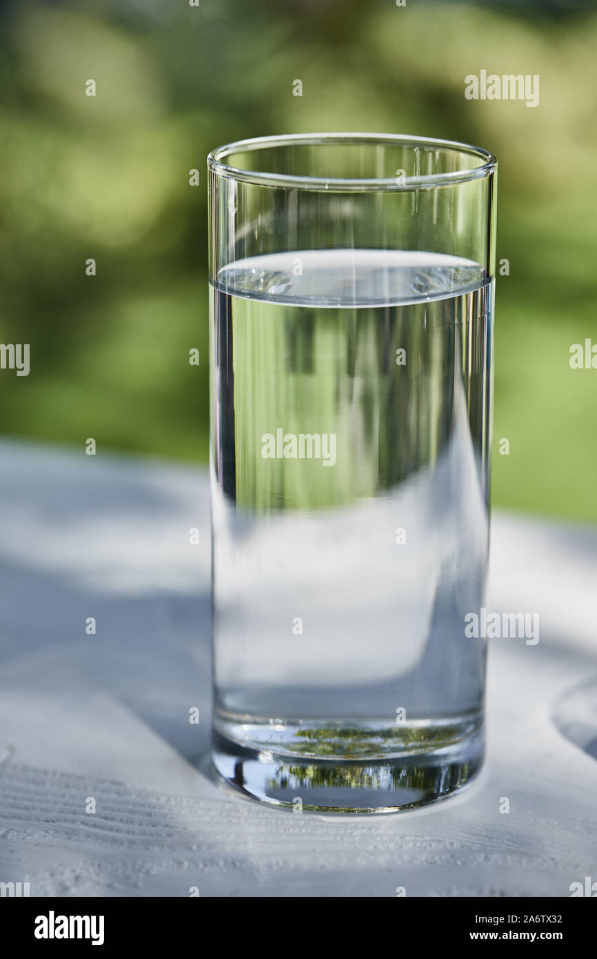 fresh clean water in transparent glass at sunny day outside Stock Photo ...