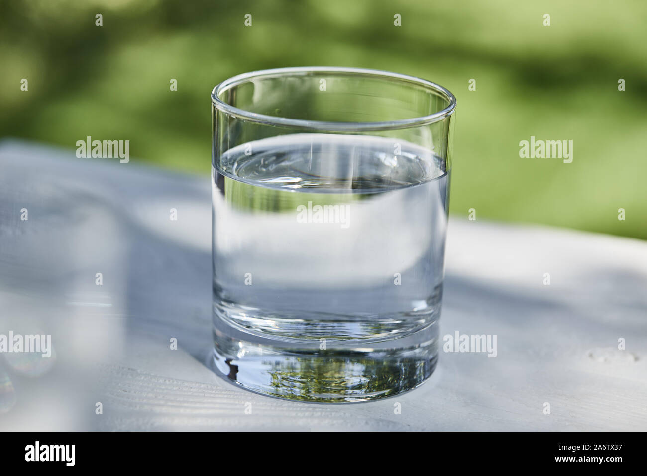 fresh clean water in transparent glass at sunny day outside Stock Photo ...