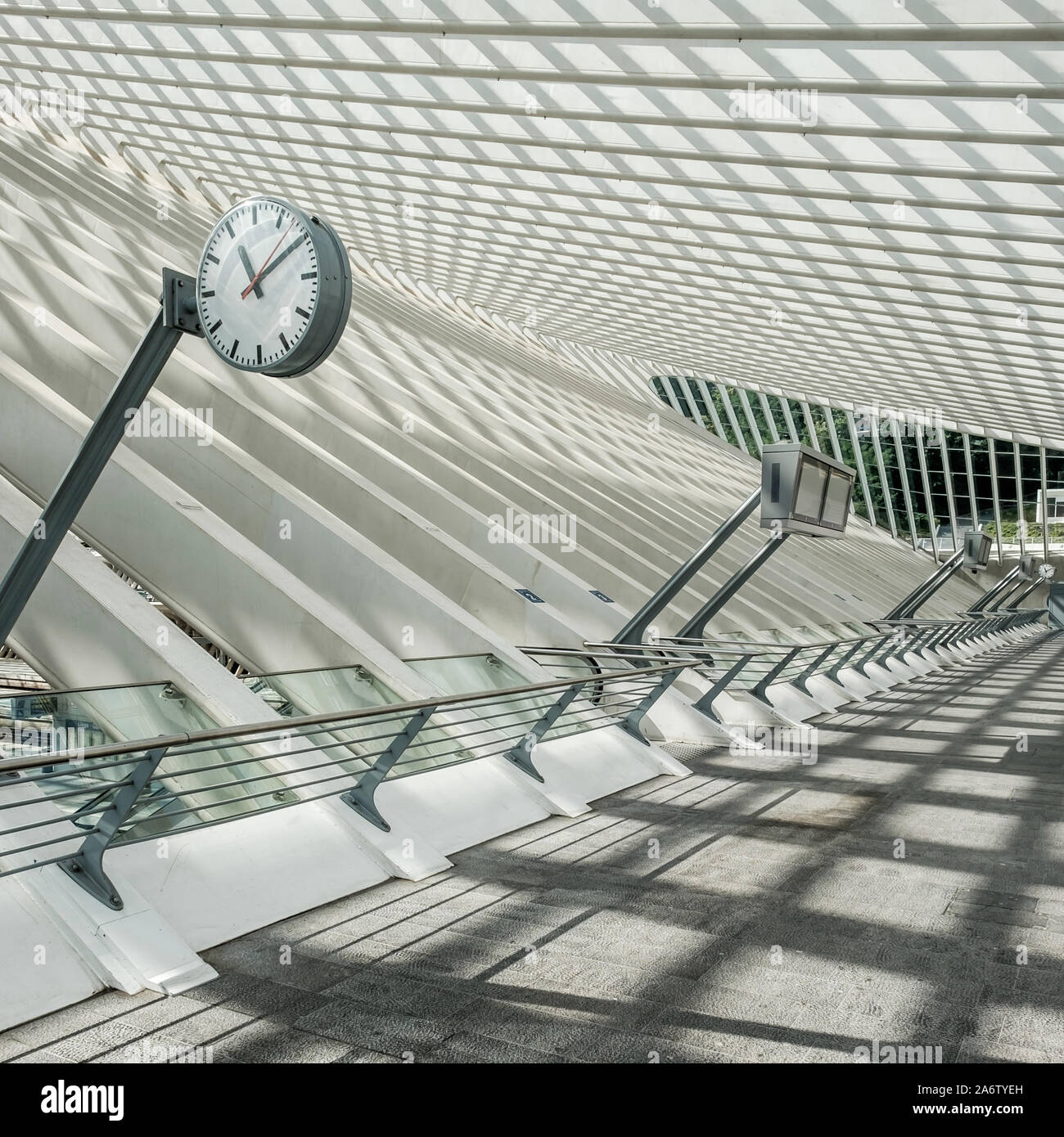 Clock in the modern train station of Liege in Belgium Stock Photo - Alamy