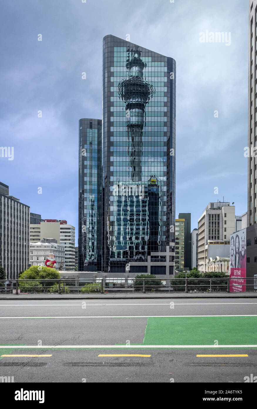 Famous Sky Tower reflected in office building in downtown Auckland ...