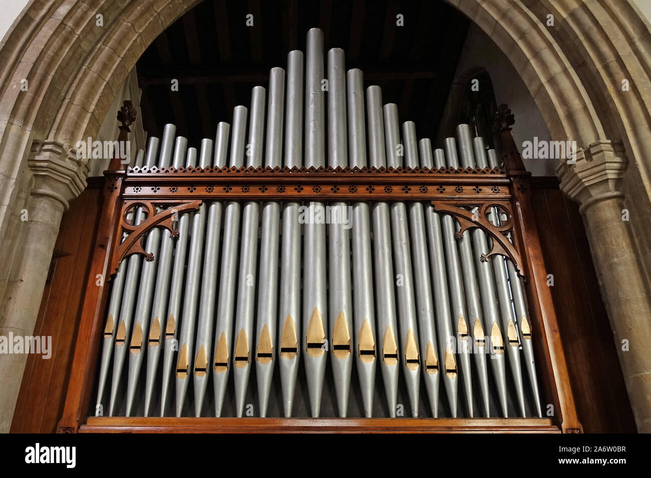 Old silver painted church pipe organ inside St. Johns church, Stamford ...
