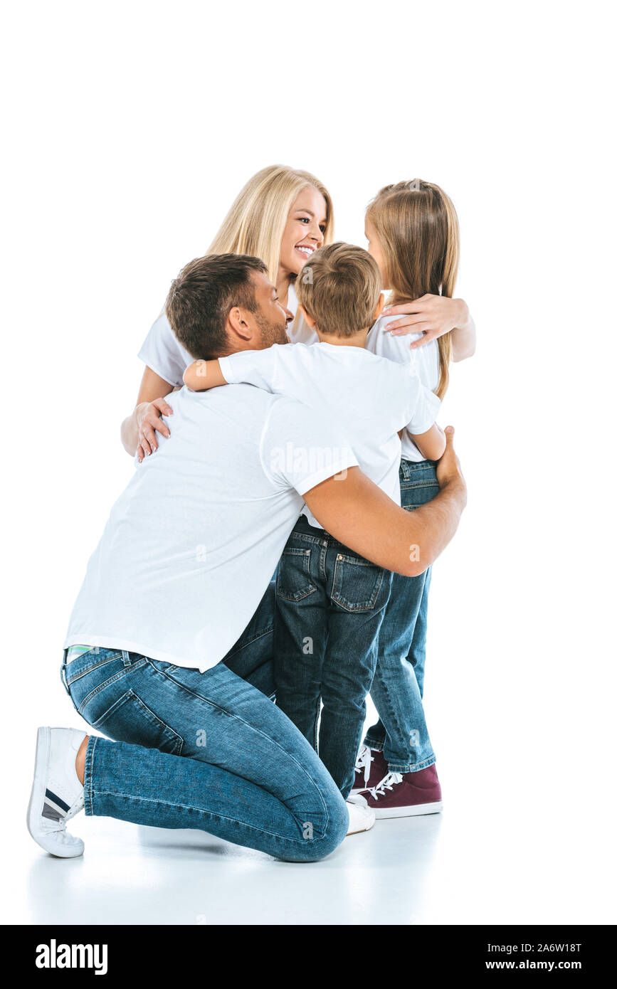 happy parents smiling while hugging cute kids on white Stock Photo - Alamy