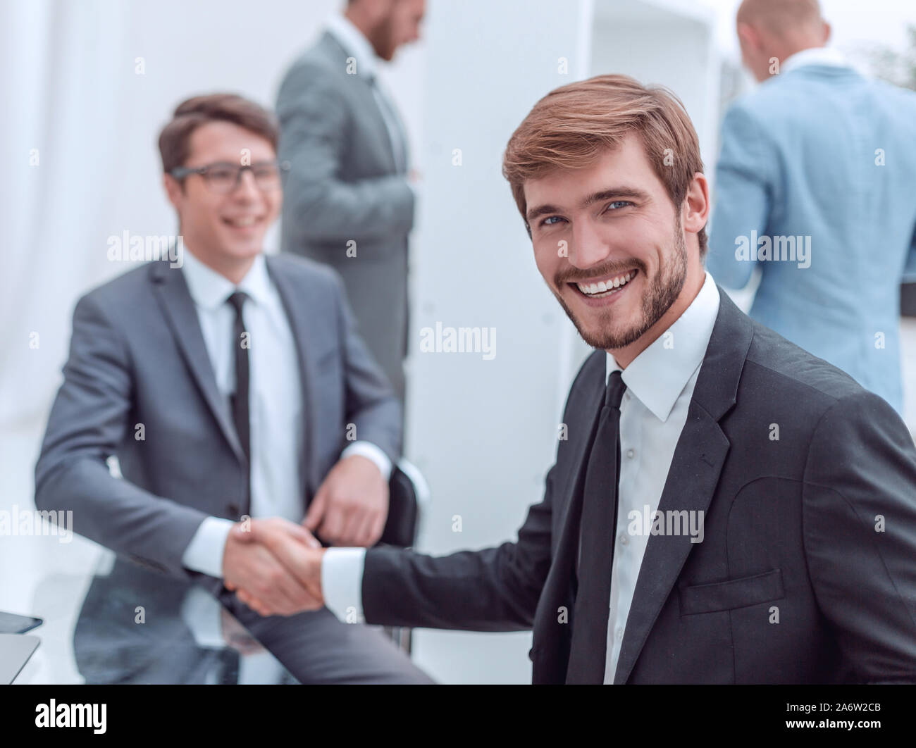 happy entrepreneur shaking hands with his business partner. concept of ...