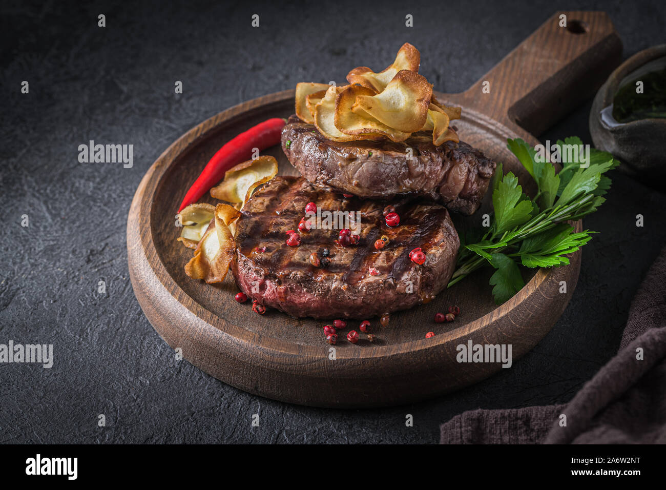 Two fillet mignon steaks with crispy parsnip Stock Photo - Alamy