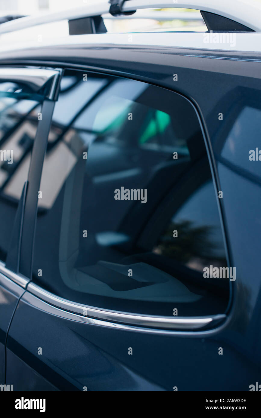 side window of black, modern polished car with reflection Stock Photo ...