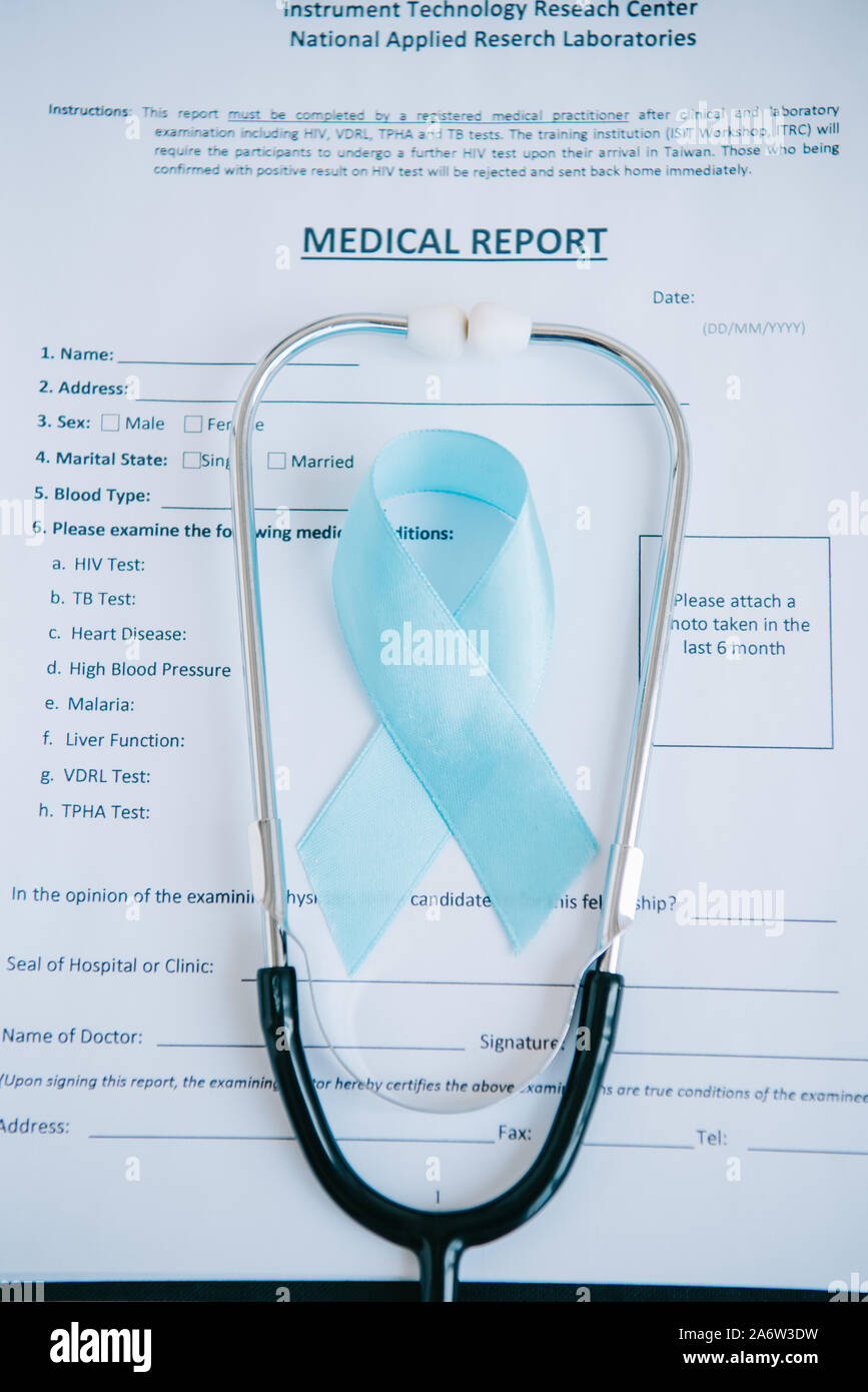 blue awareness ribbon and stethoscope on medical report Stock Photo - Alamy