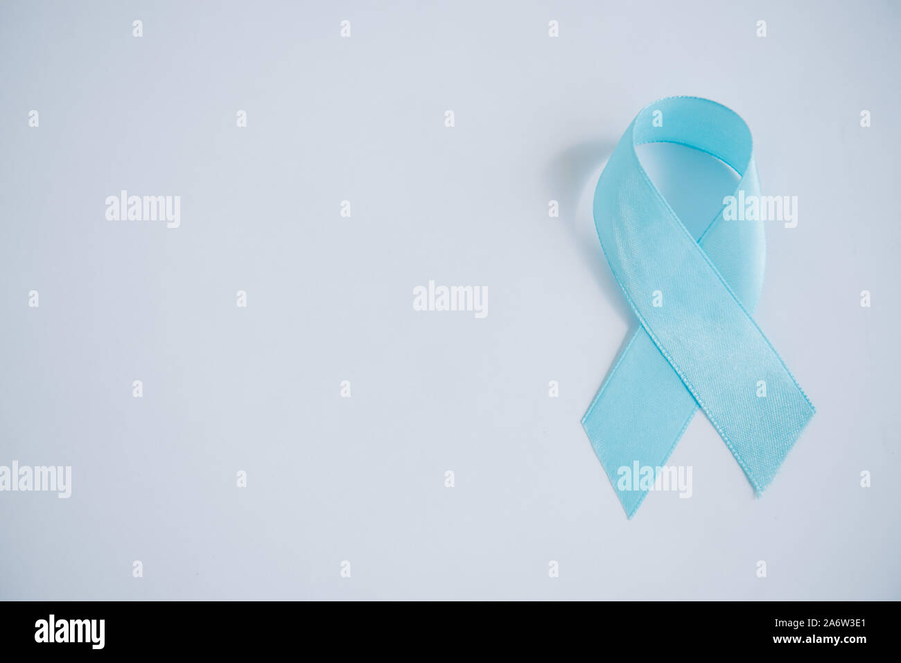 blue awareness ribbon on white background with copy space Stock Photo ...