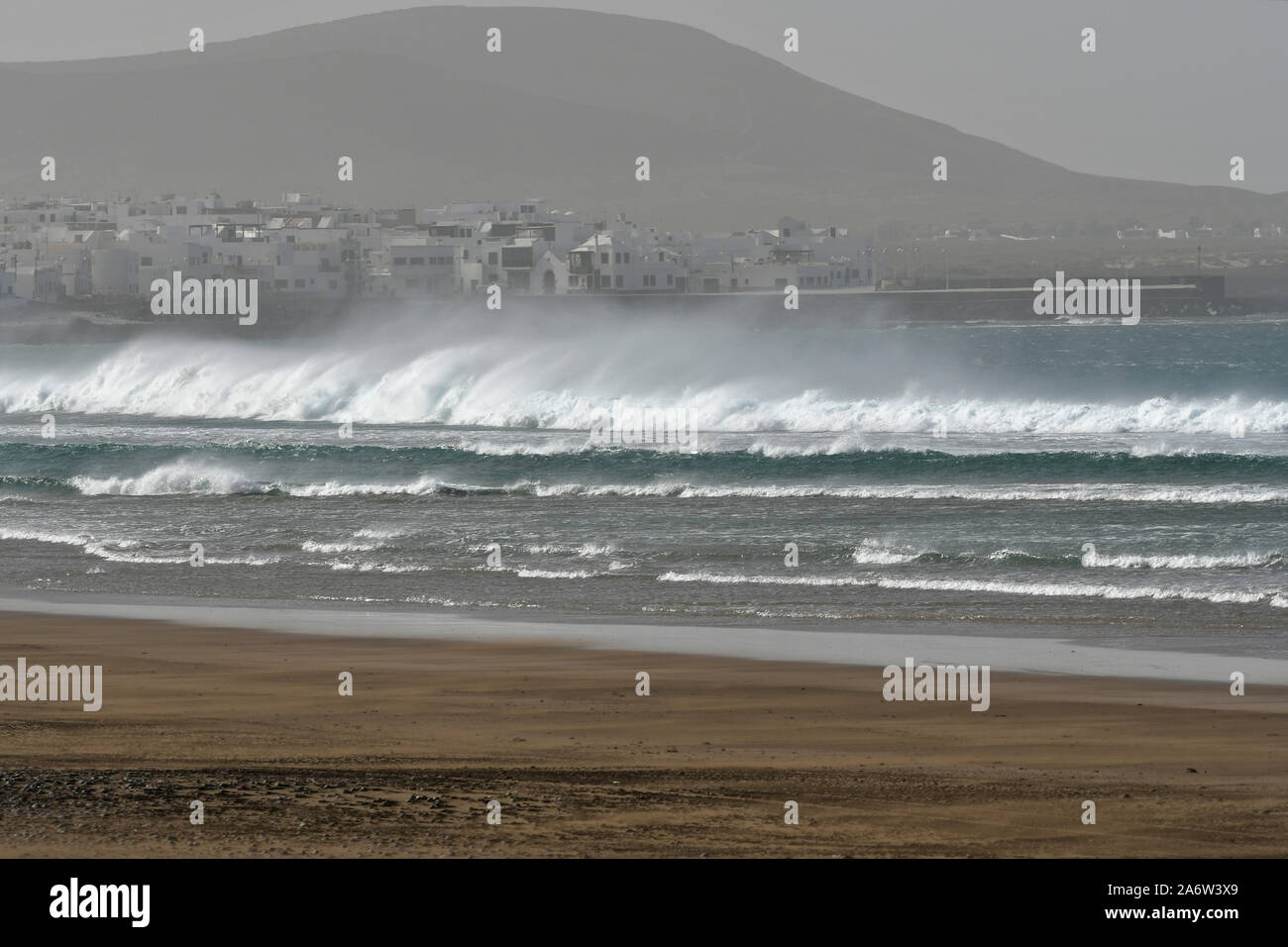 Caleta de famara beach sand building hi-res stock photography and ...