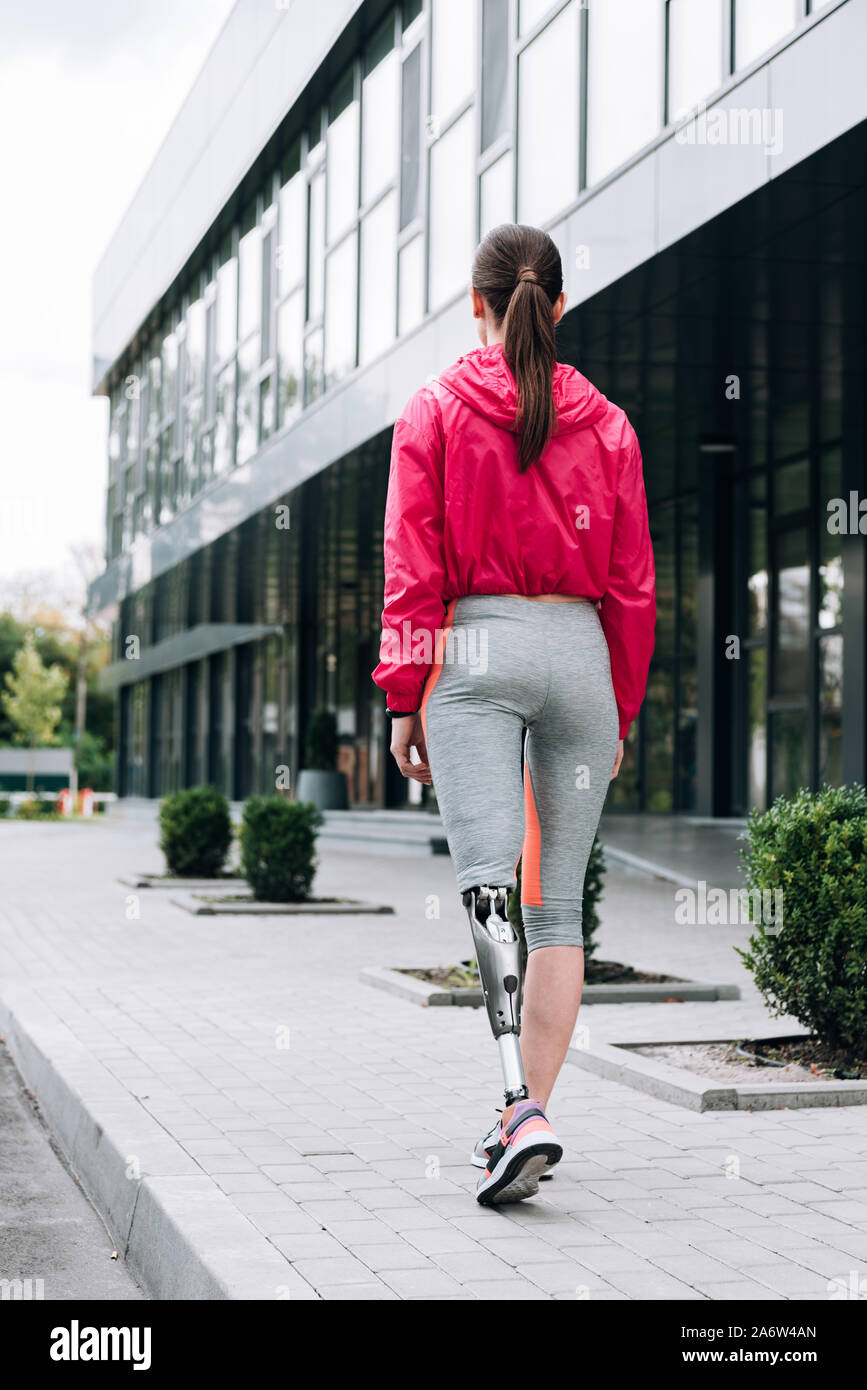 back view of disabled sportswoman with prosthesis on street Stock Photo ...