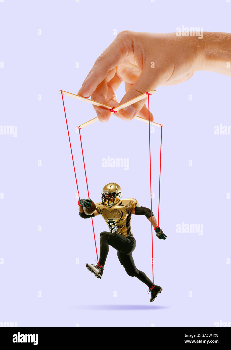 Man like a puppet in somebodies hands on purple background. Concept of ...