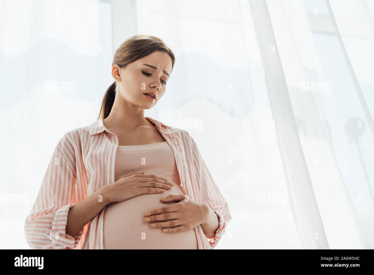 Girl pregnant belly low angle hi-res stock photography and images - Alamy