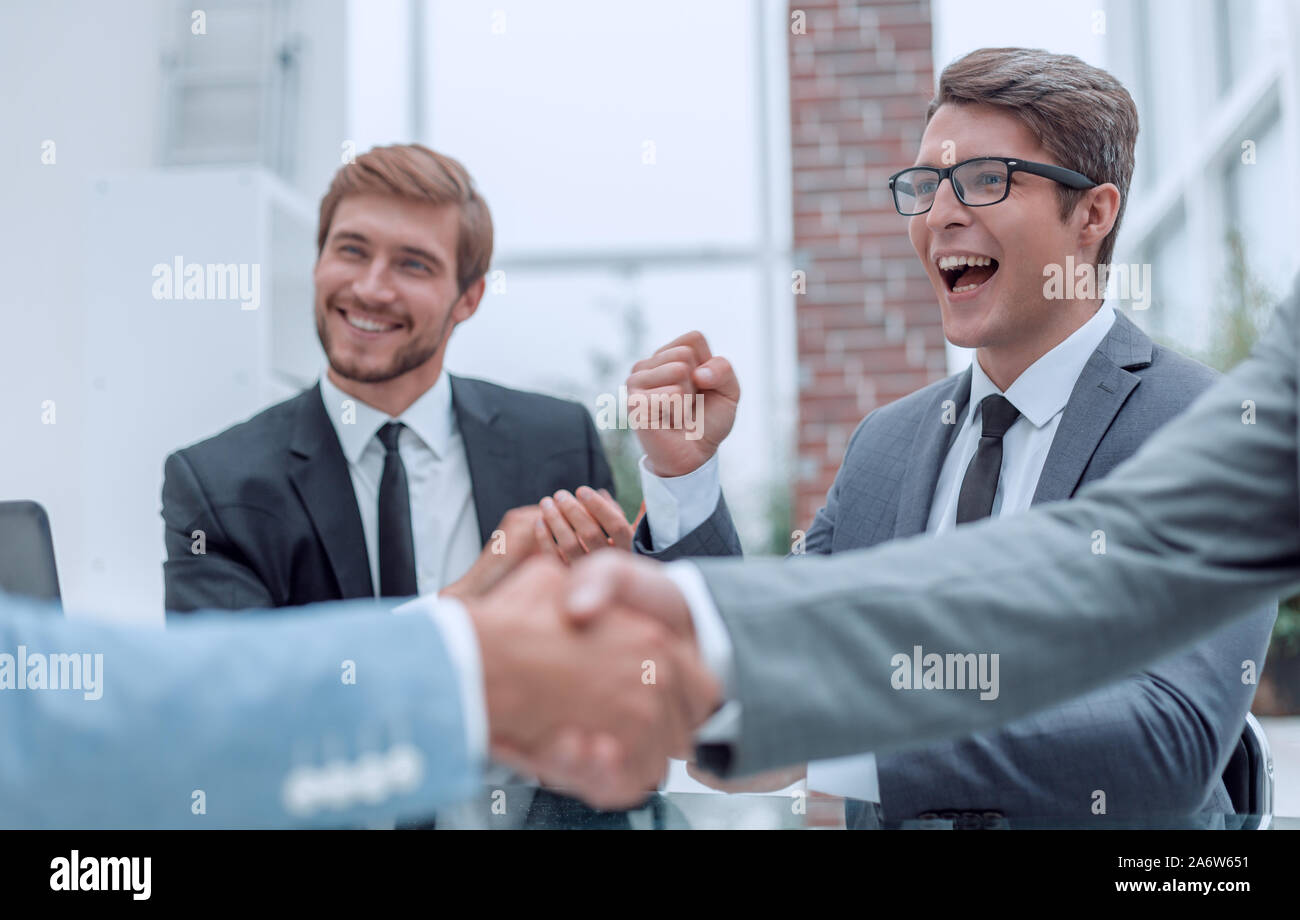 close up. handshake of business people on a blurred office background ...