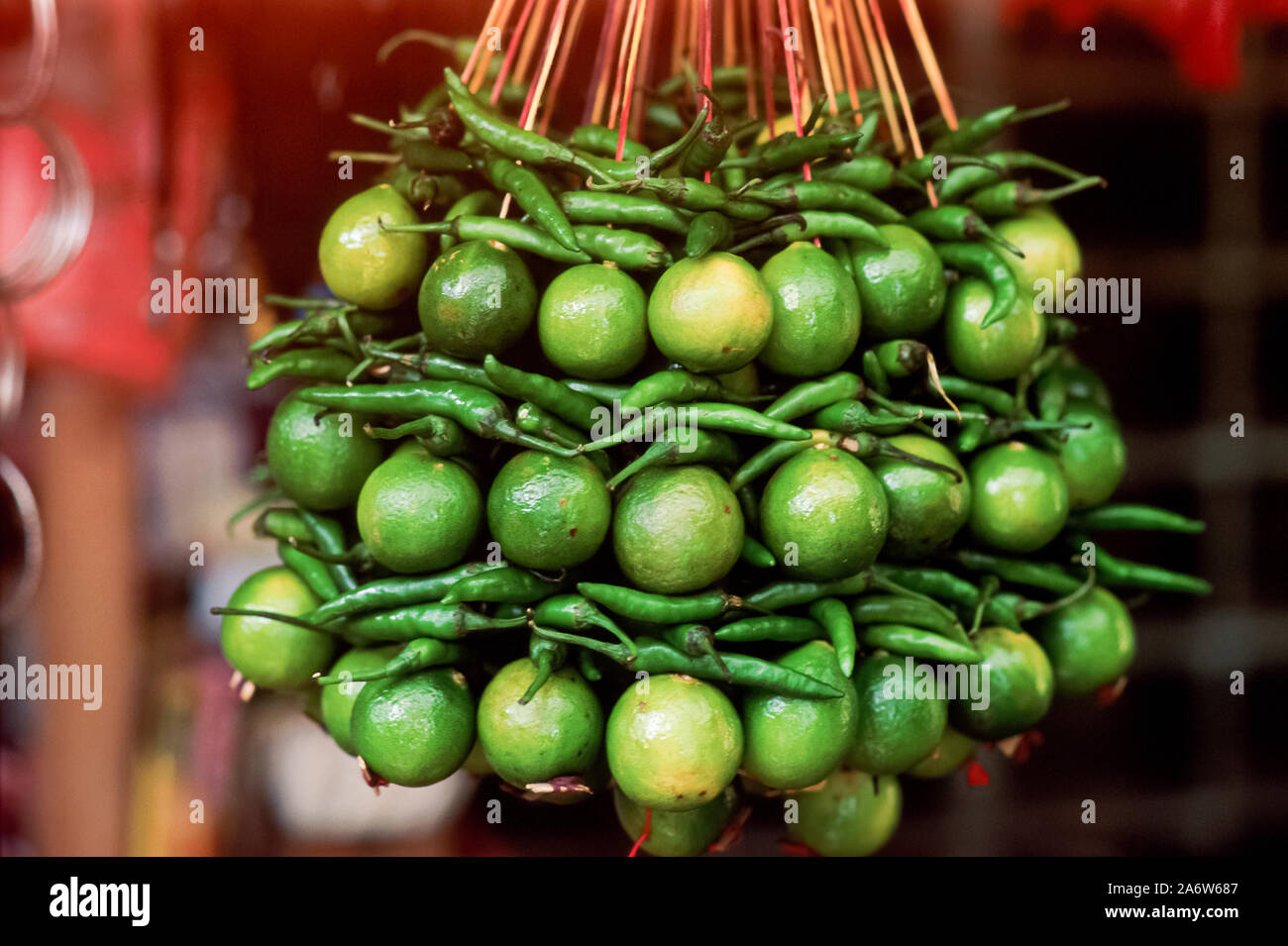 Green chili peppers and lime. According to Indian traditional belief a ...