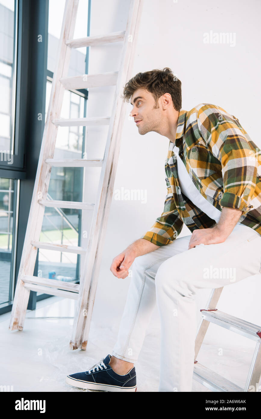 Man sitting on ladder hi-res stock photography and images - Alamy