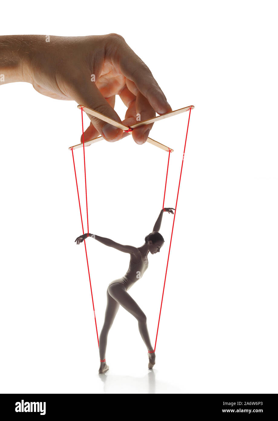 Woman like a puppet in somebodies hands on white background. Concept of ...