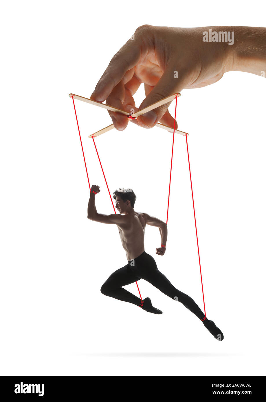 Man like a puppet in somebodies hands on white background. Concept of ...