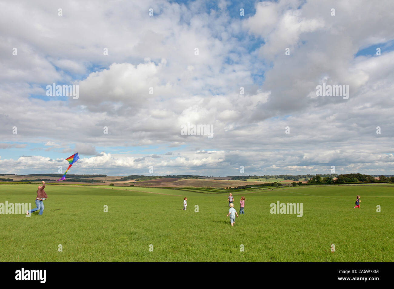 Kids flying a kite on open fields, England Stock Photo - Alamy