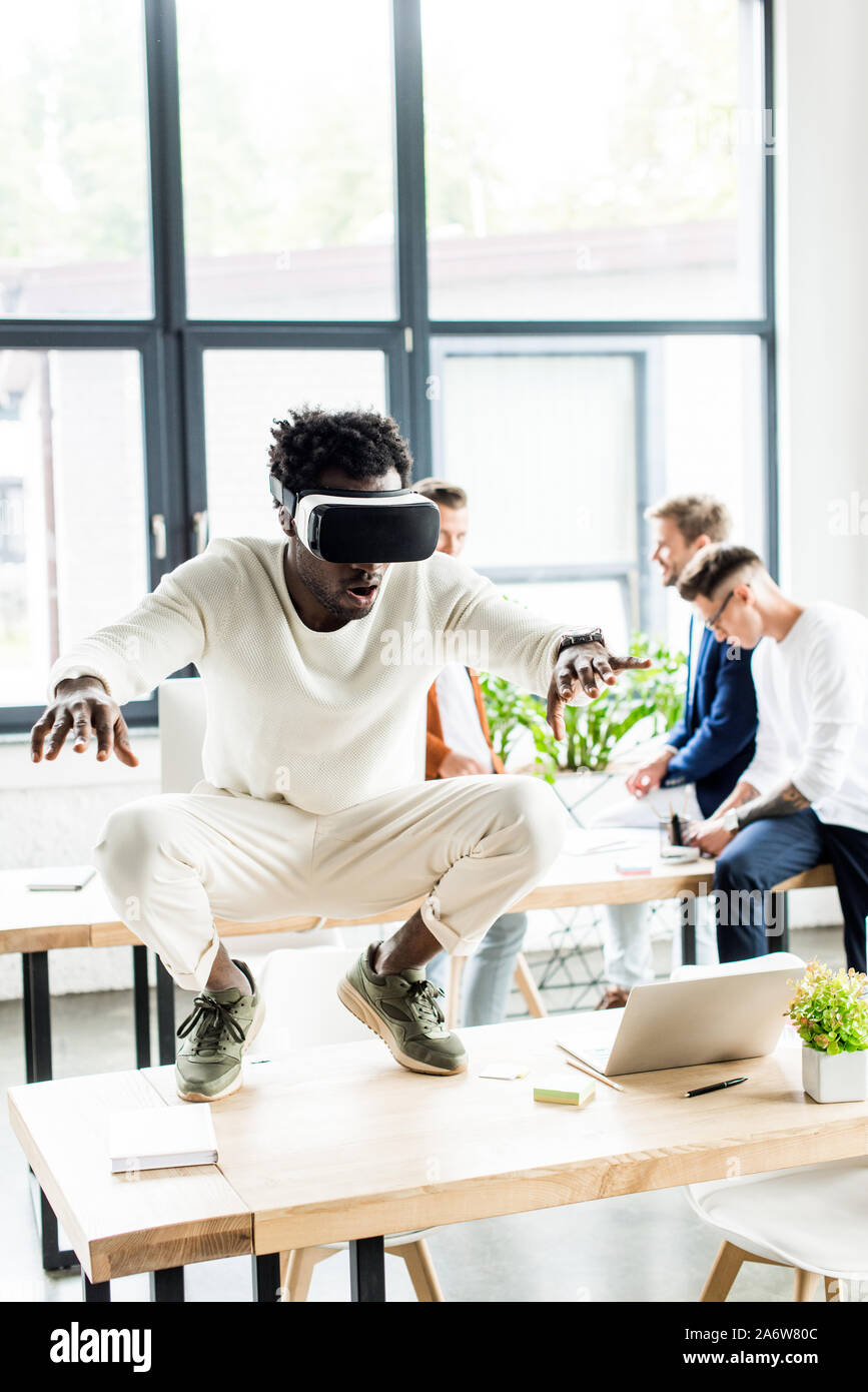 Business squatting young hi-res stock photography and images - Alamy