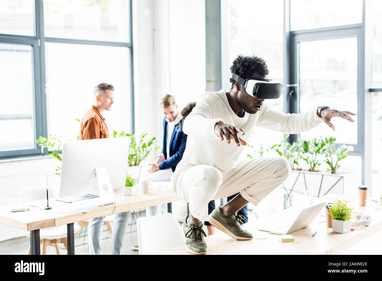 Business squatting young hi-res stock photography and images - Alamy