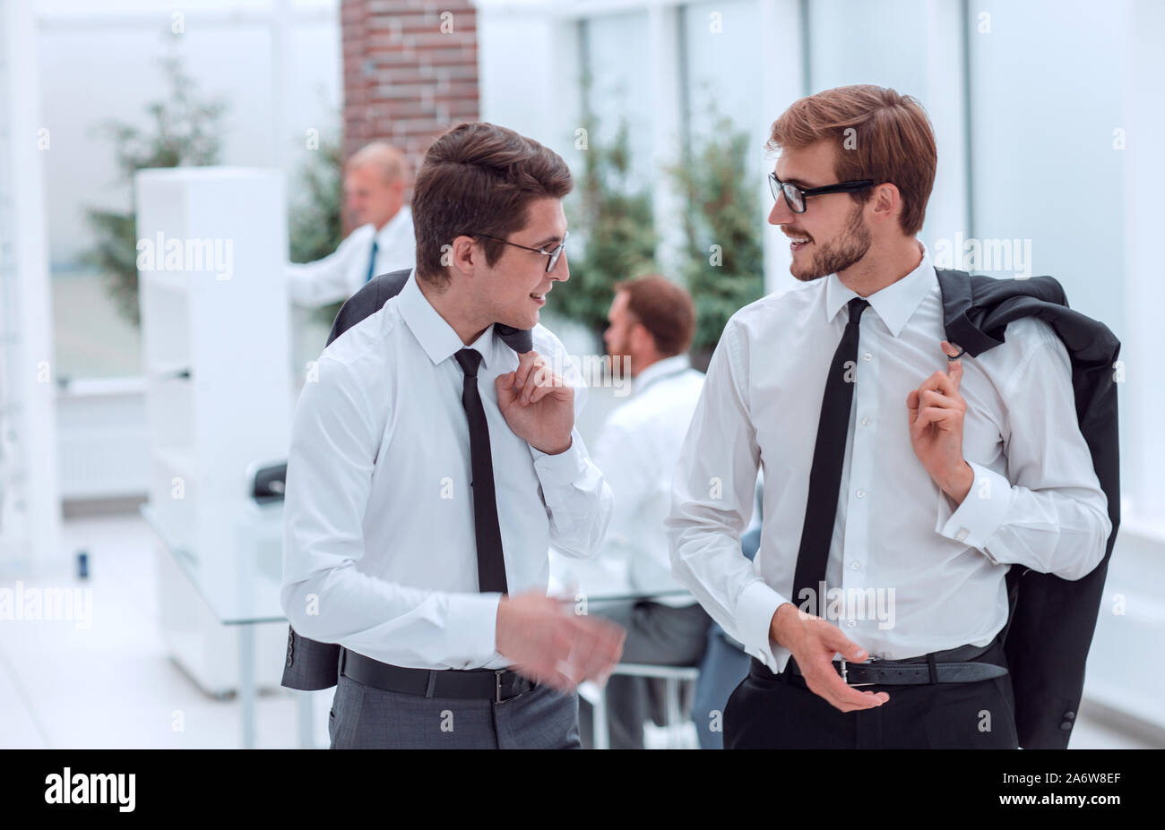 business colleagues discussing something in the workplace. office ...