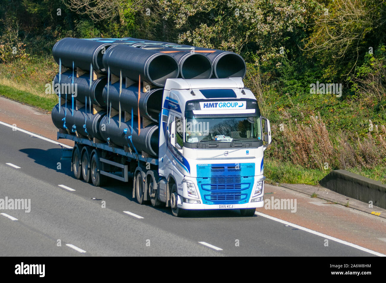 HMT Group carrying plastic piping; Haulage delivery trucks, lorry ...