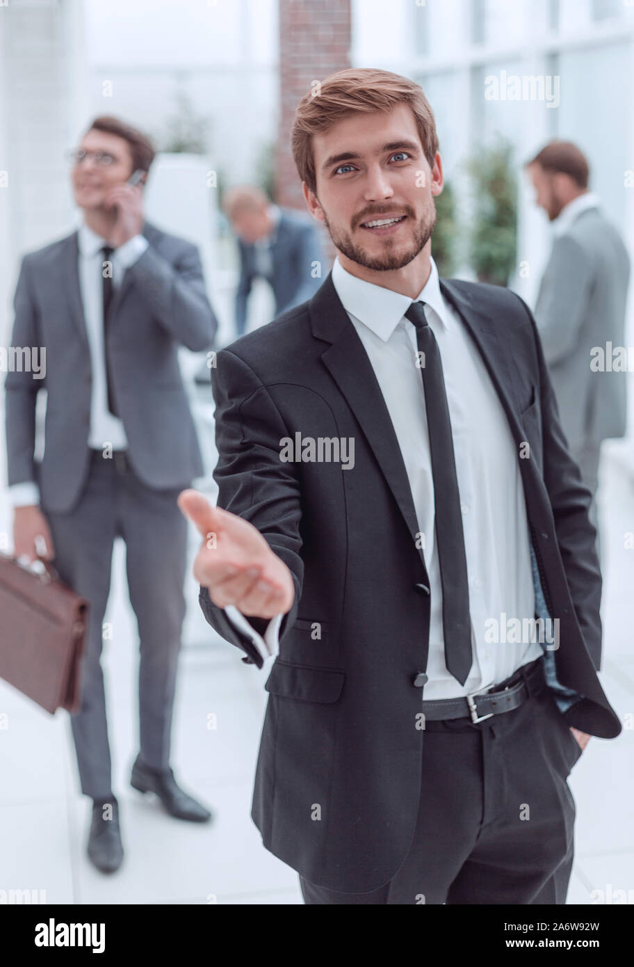 close up. friendly business man standing in the Bank office. concept of ...