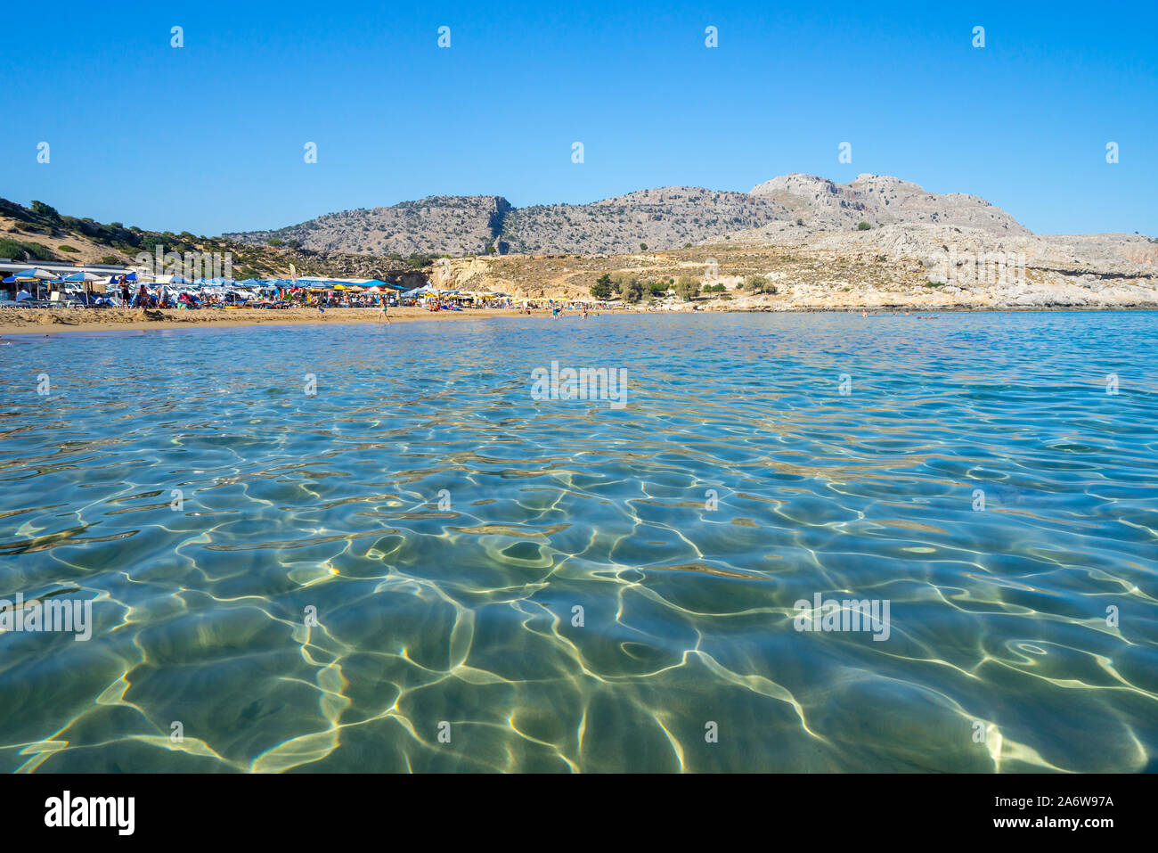 The beautiful golden sandy Agathi Beach on the Dodecanese Island of ...