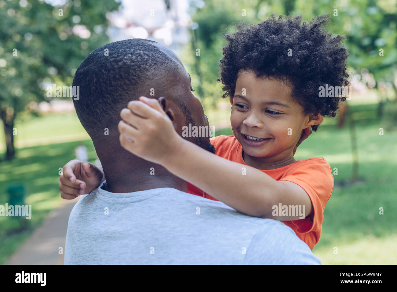 Boy hugging father hi-res stock photography and images - Alamy