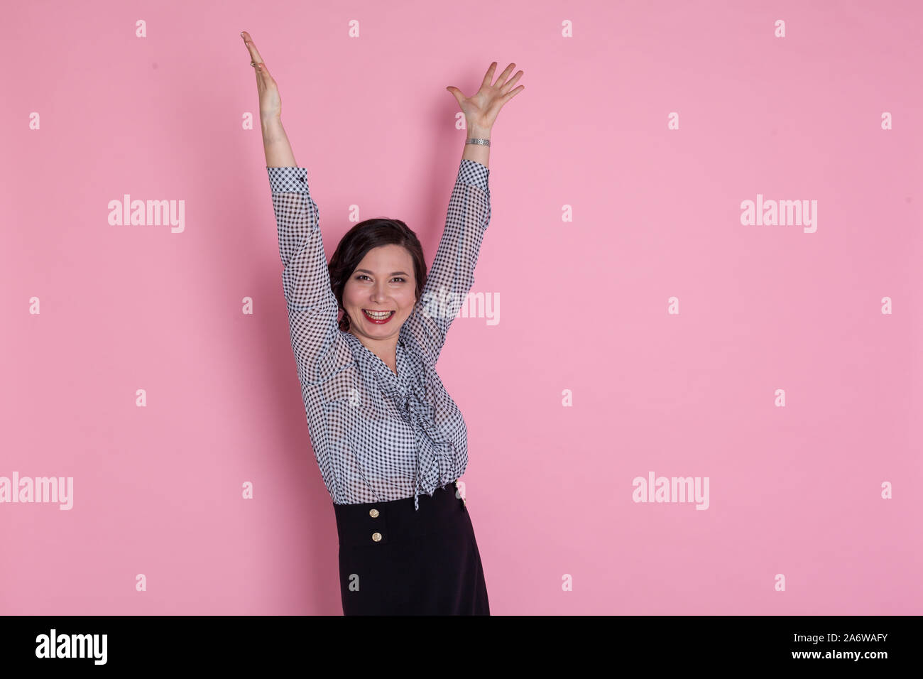 Asian woman in business suit raised her hands up Stock Photo - Alamy