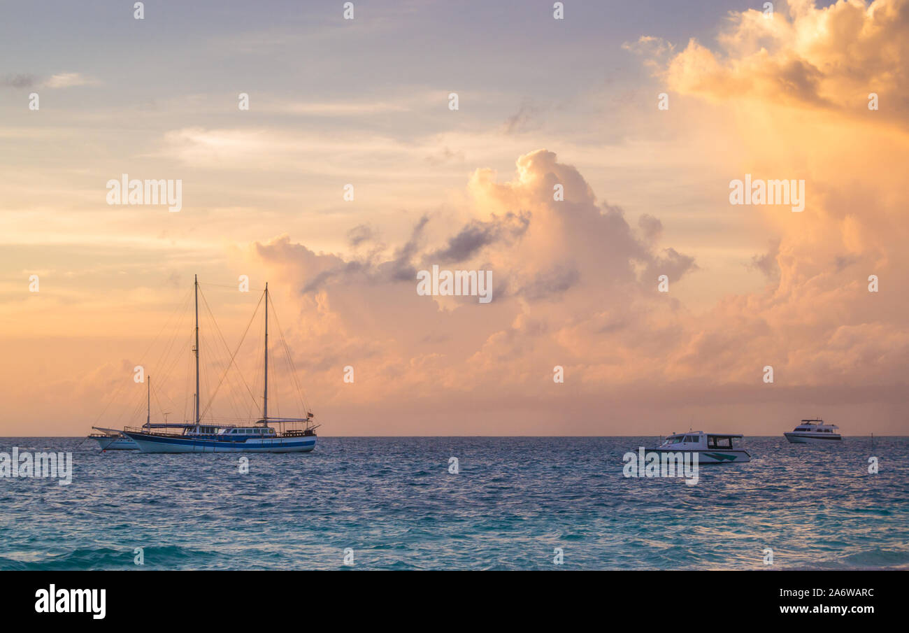 Calm sea boats floating hi-res stock photography and images - Alamy