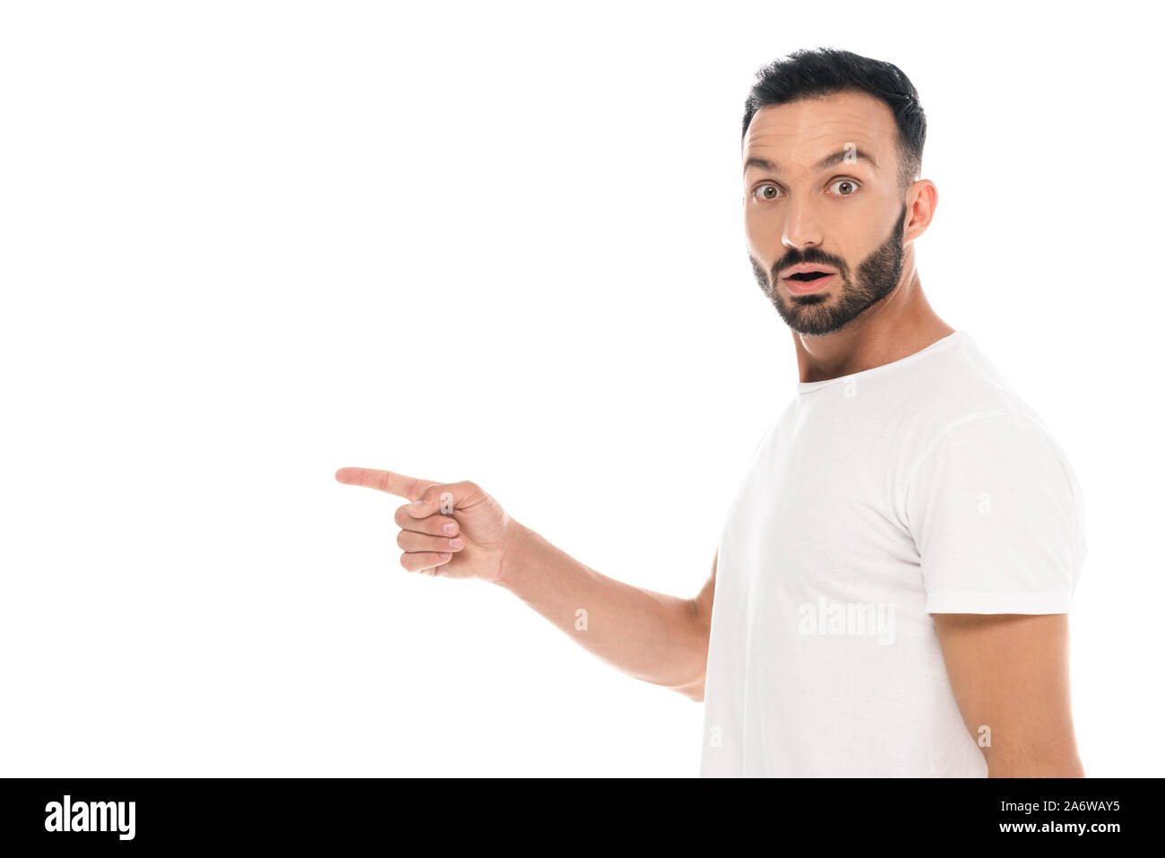 surprised man pointing with finger and looking at camera isolated on ...