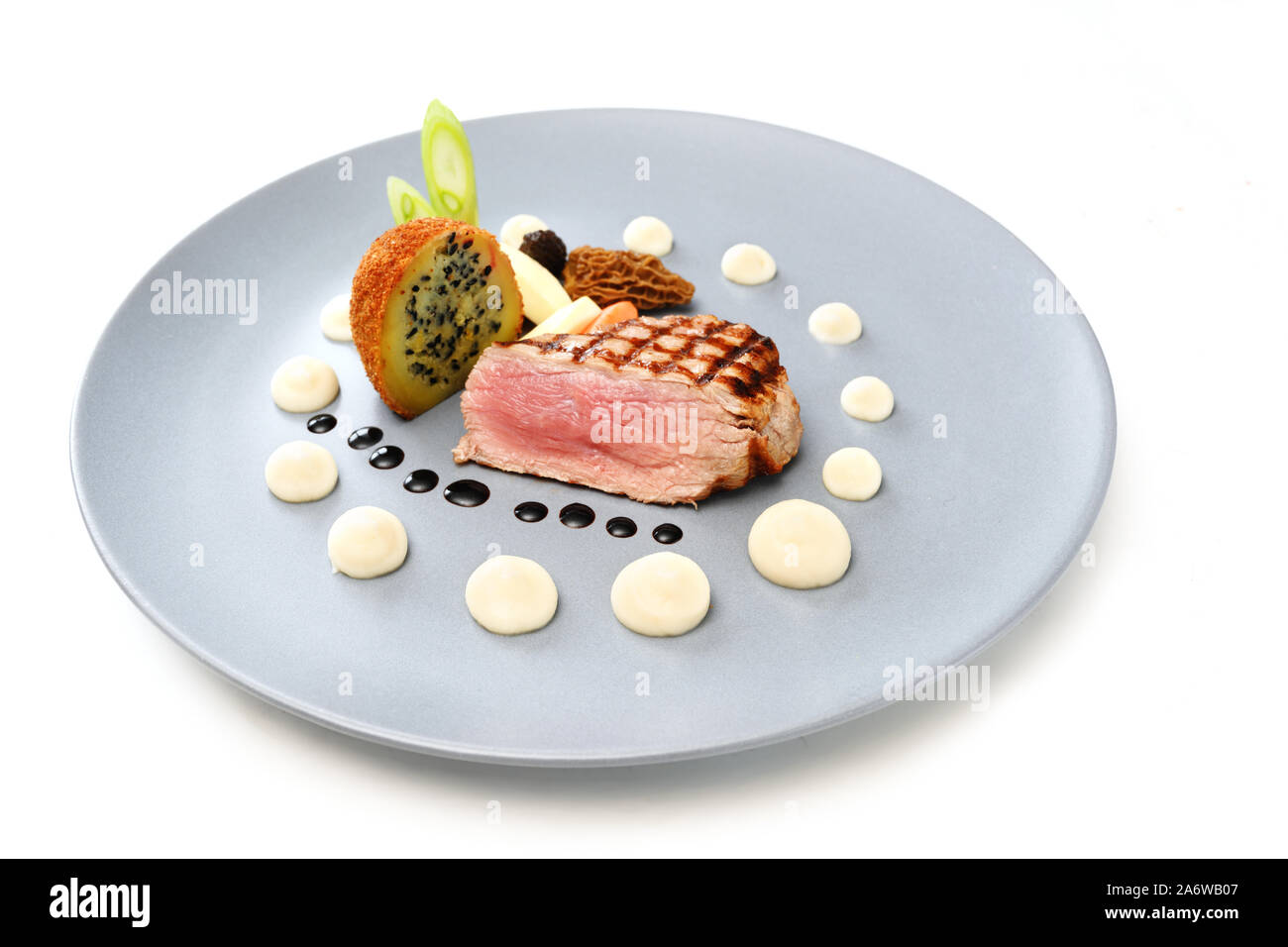 roasted veal, morels, vegetables and a fried potato stuffed with onion ...