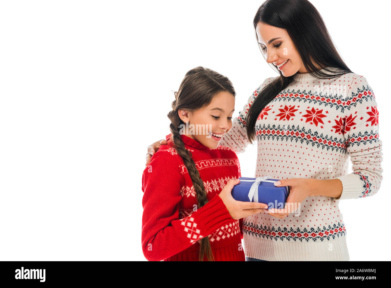 cheerful mother giving blue present to daughter isolated on white Stock ...