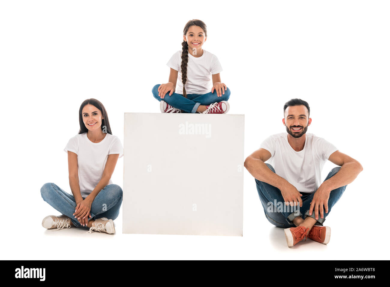 happy kid sitting on cube near cheerful parents isolated on white Stock ...