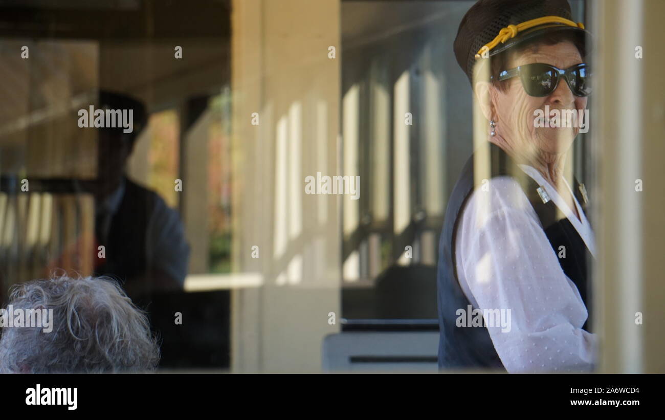 Train conductor taking tickets on a historic Sierra Railway steam ...