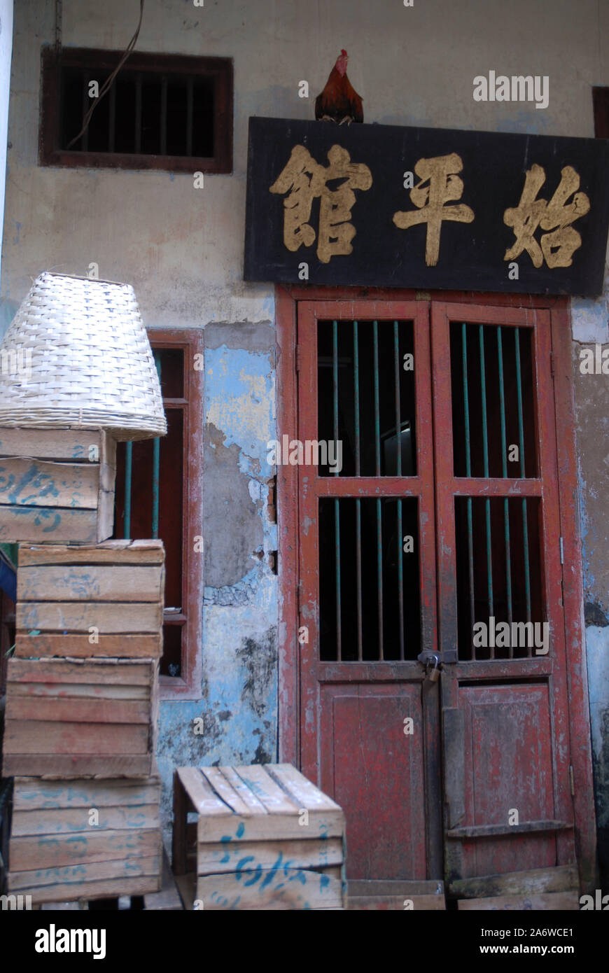 Chicken stood on door sign, Yangon, Myanmar Stock Photo - Alamy
