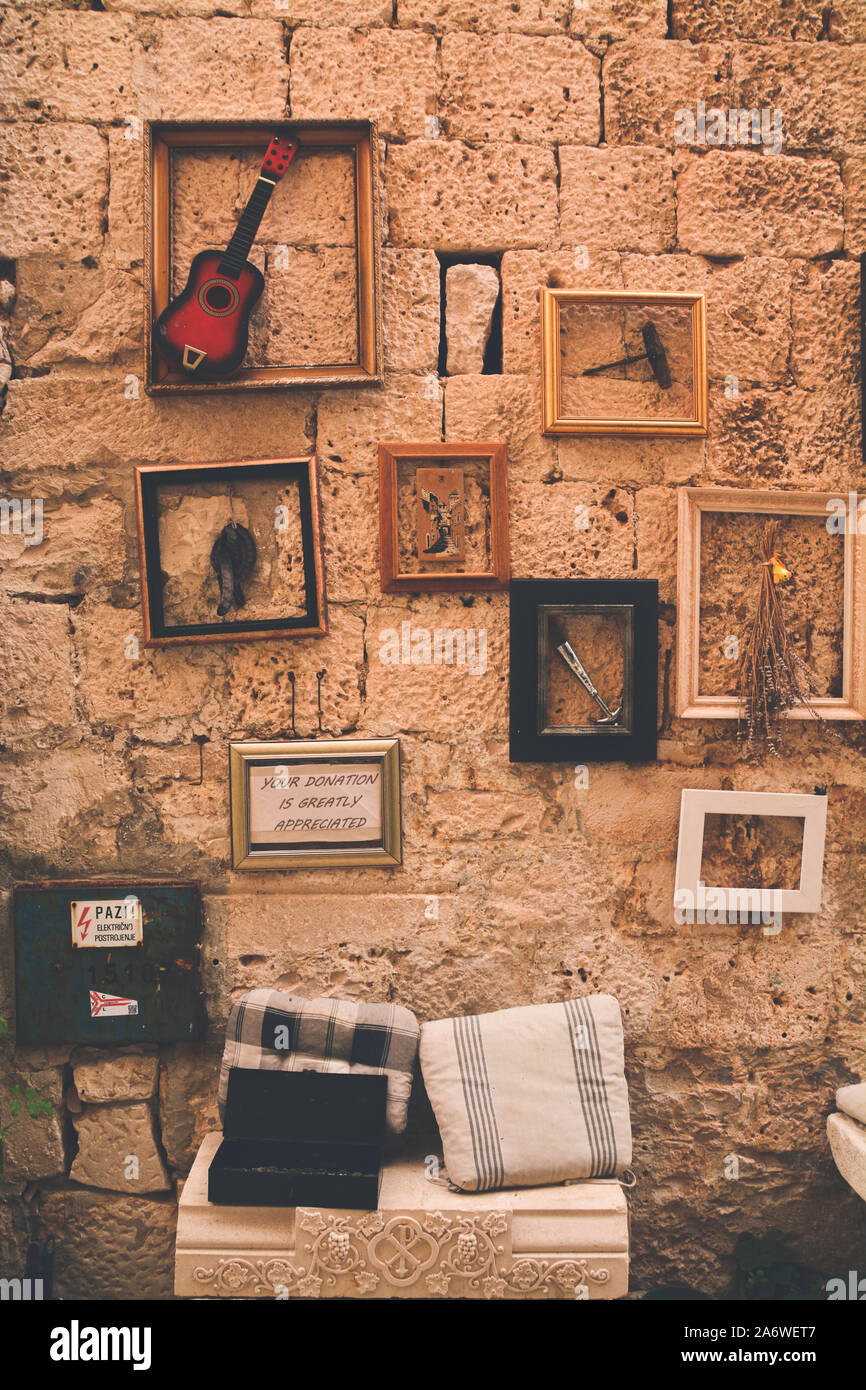 Multiple art display on street wall Stock Photo - Alamy