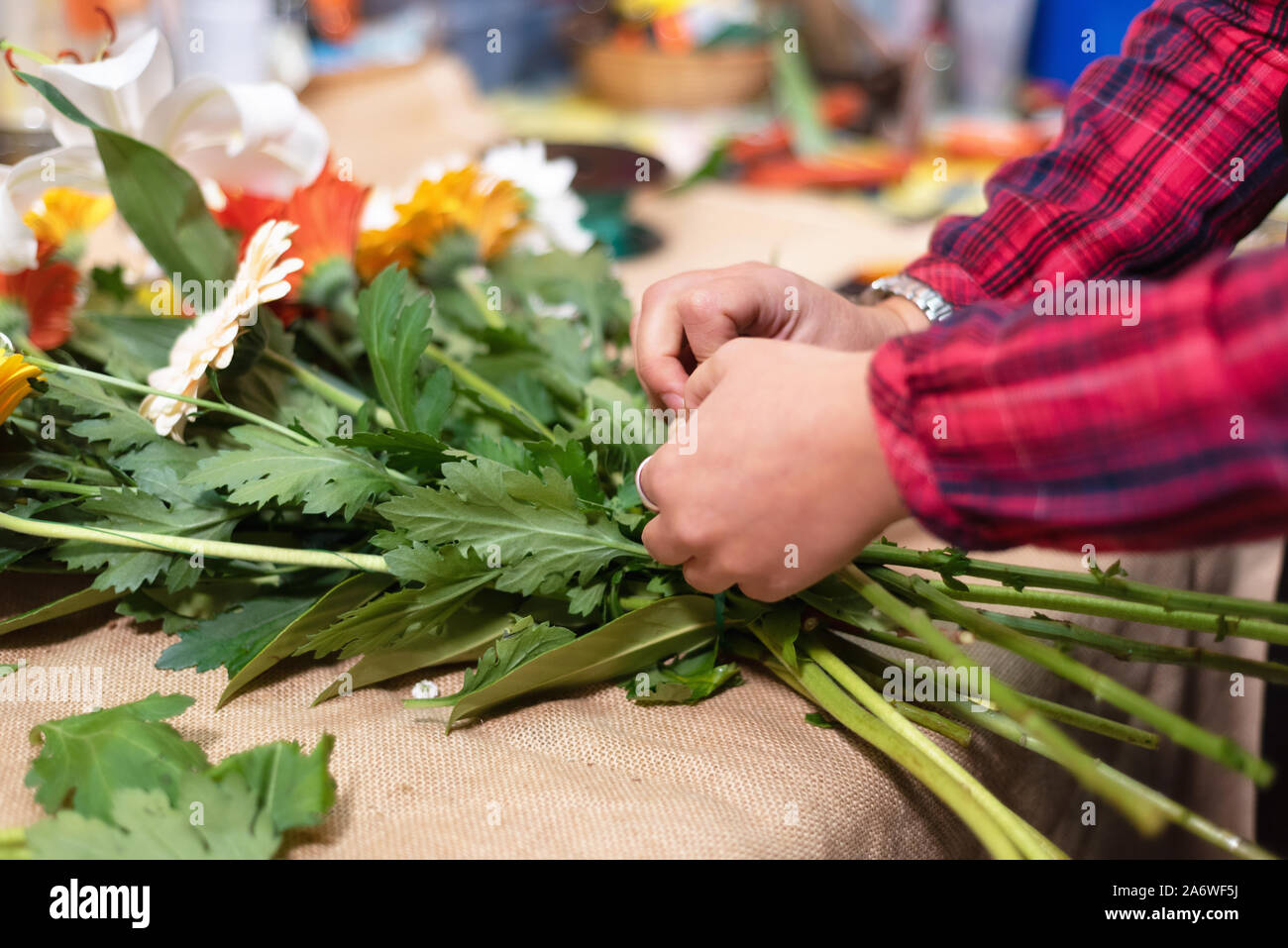 Person creating making floral bouquet hi-res stock photography and ...