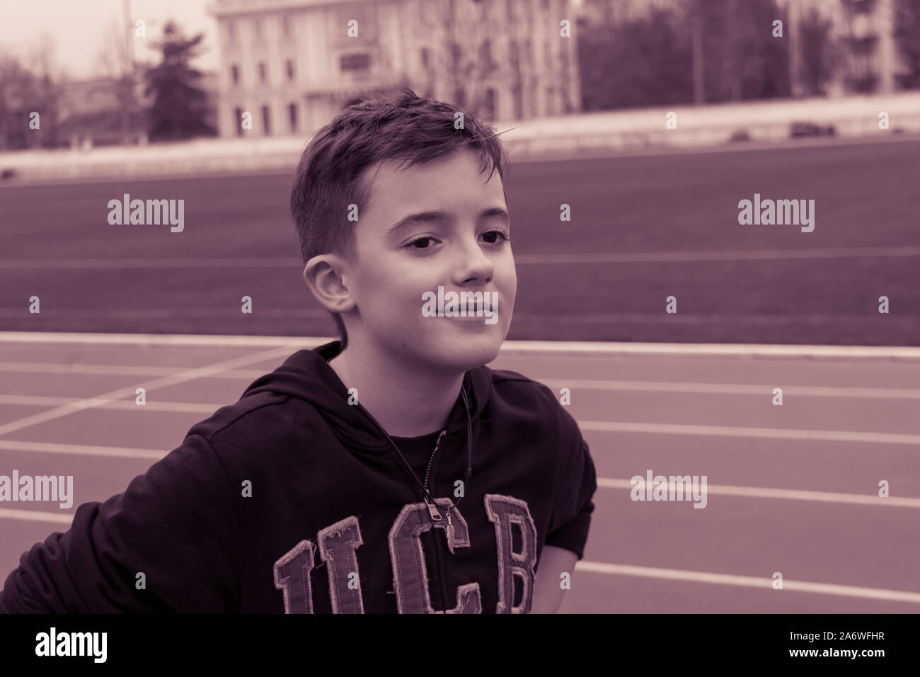 Boy on running track hi-res stock photography and images - Alamy