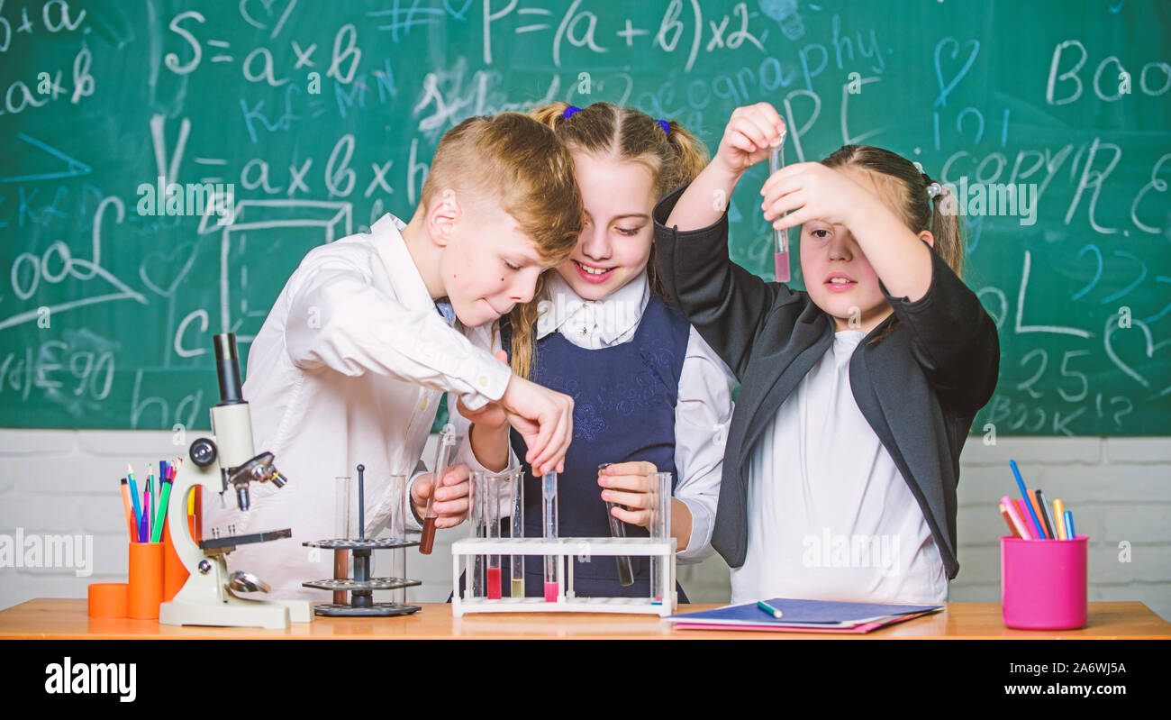 Chemistry equipment. students doing experiments with microscope in lab ...