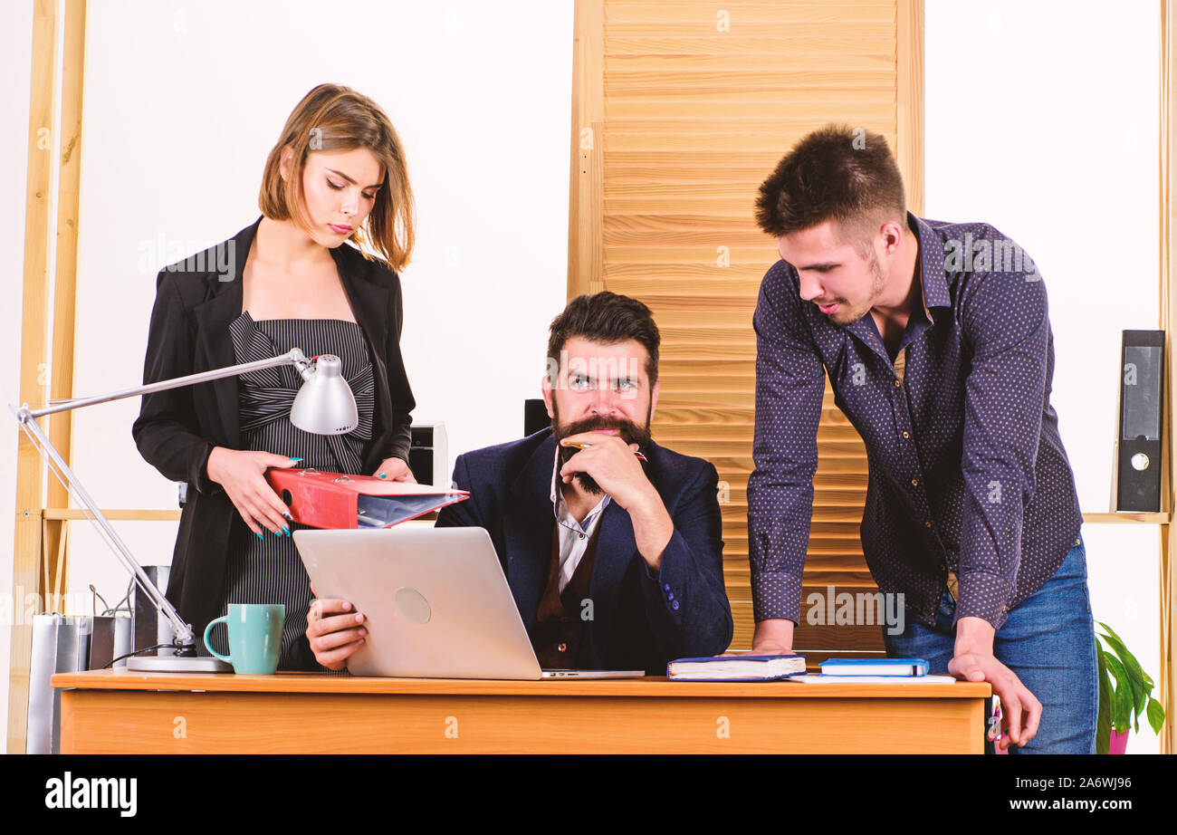 Teamwork in action. Business team working and communicating together at ...