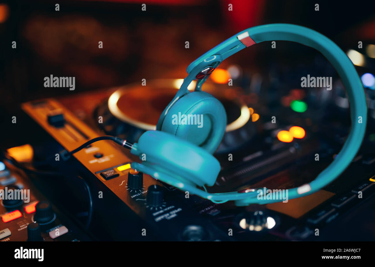 Closeup pair of aqua blue emerald green headphones for DJ.cd mp4 music ...