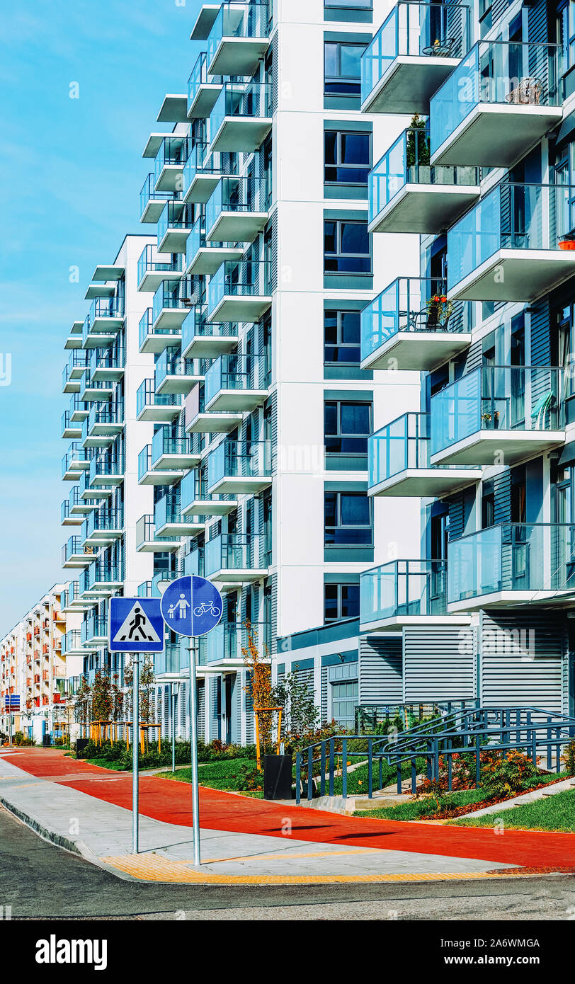 Modern residential apartment and flat building exterior with pathway ...