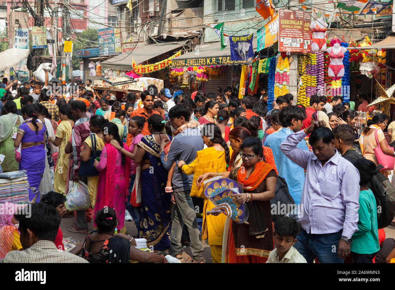 Shoppers crowd the streets in a market in the Sadar Bazar district of ...