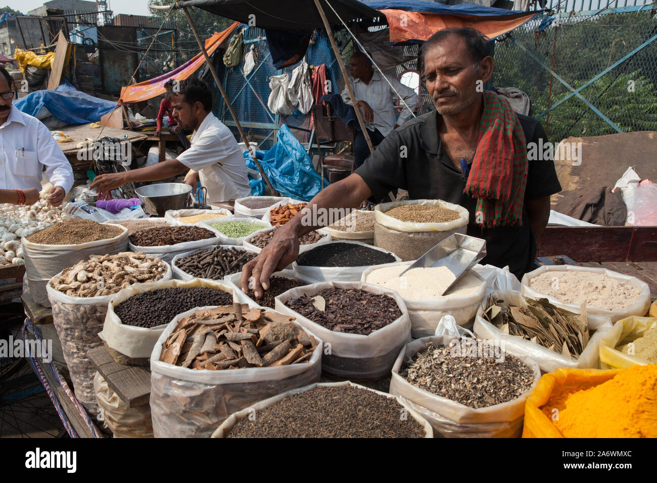 A vendor in the spice market in the old city of Delhi Stock Photo - Alamy