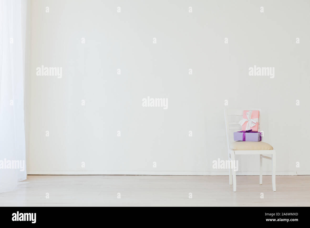 one old vintage chair in an empty white room Stock Photo - Alamy