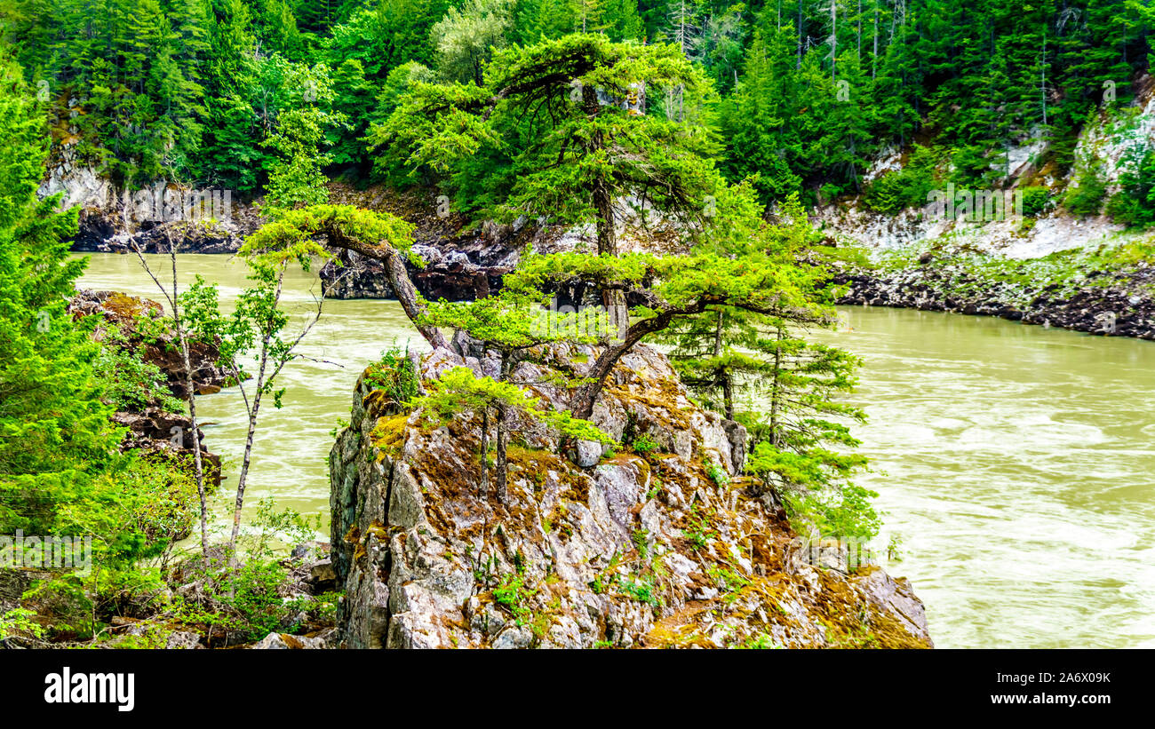 The rugged shoreline with large rock formations along the mighty Fraser ...