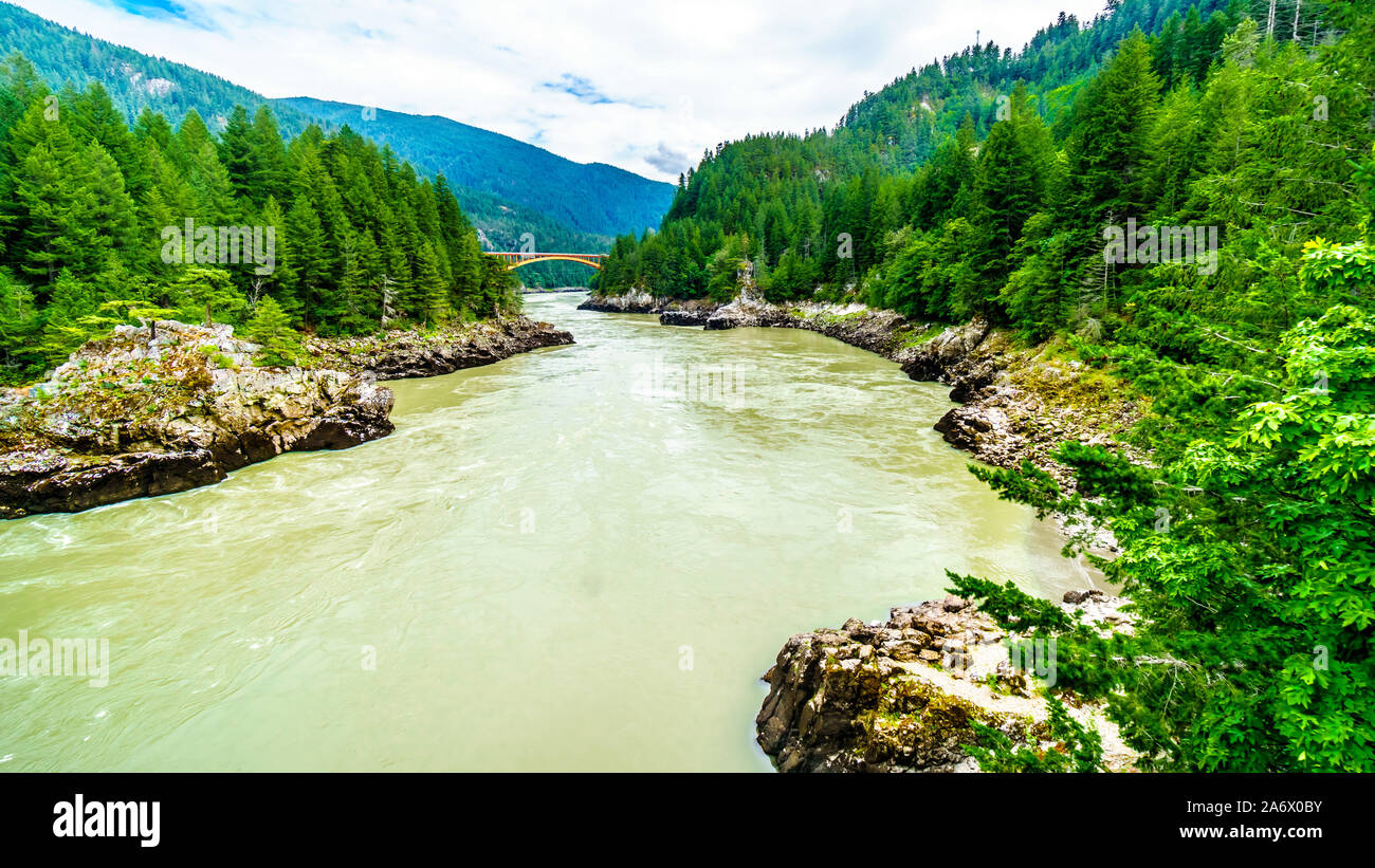 The mighty Fraser River, with the the arch shaped steel structure of ...