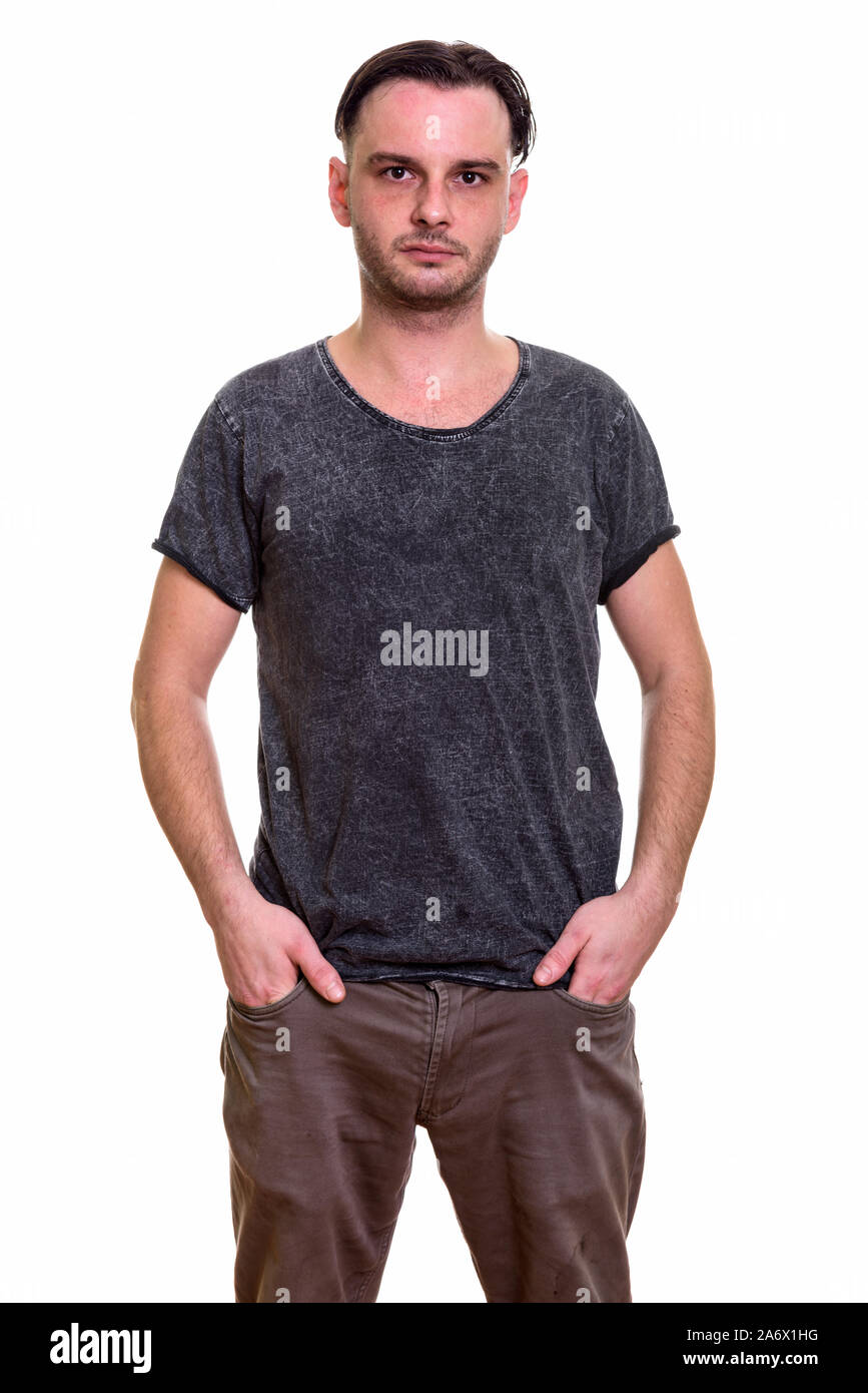 Studio shot of man standing and looking at camera Stock Photo - Alamy