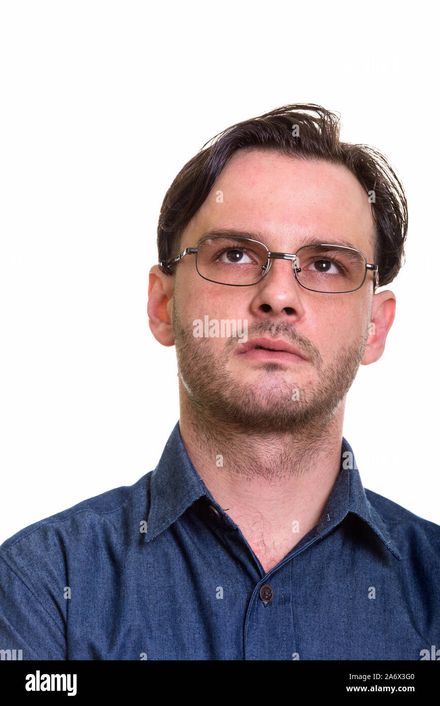 Face of formal young man thinking while wearing eyeglasses Stock Photo ...